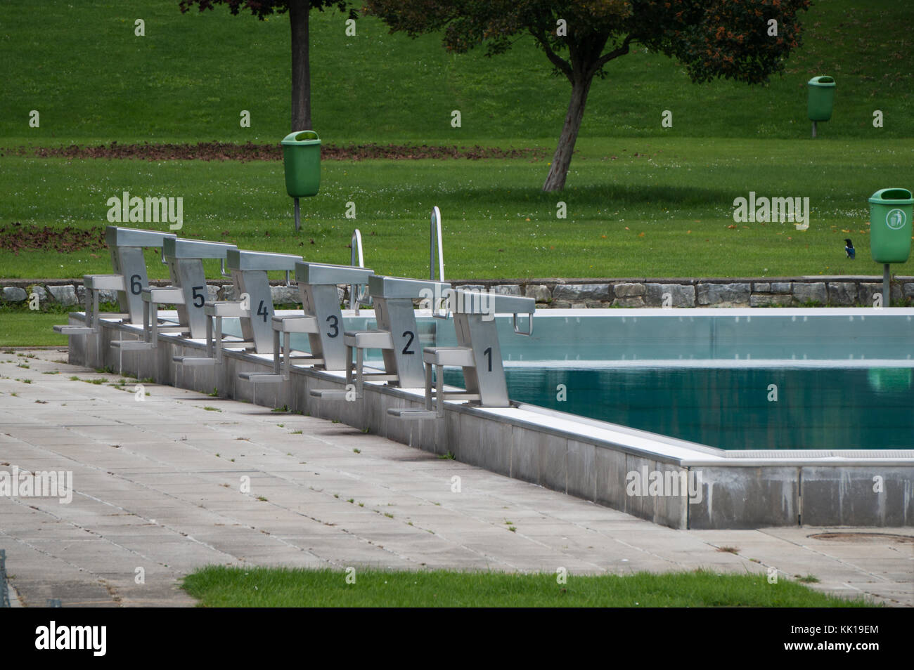 Outdoor swimming pool starting blocks Stock Photo - Alamy