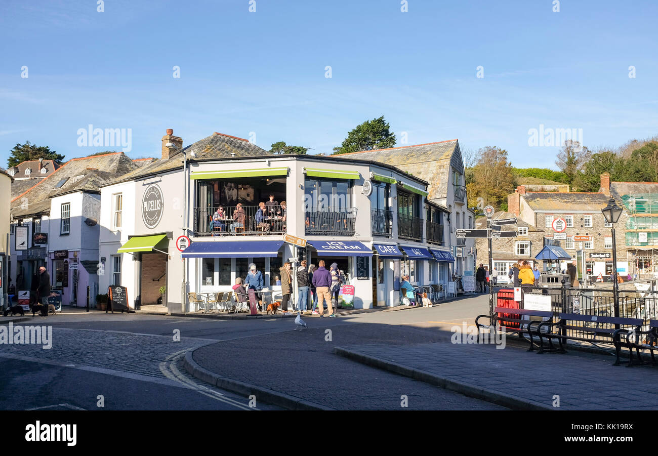 Visitors at a cafe overlooking the harbour at Padstow in Cornwall UK ...