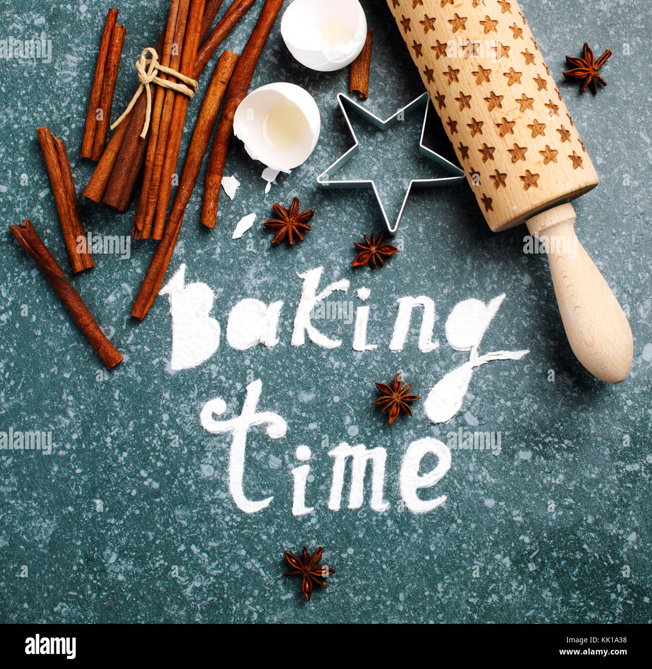 Baking time. Flour sprinkled on the blue table with text baking time ...