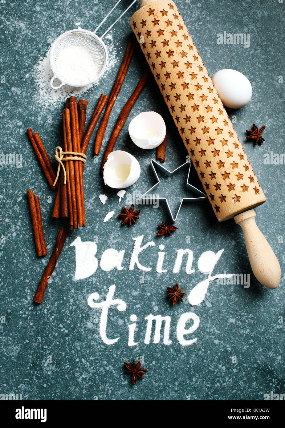 Baking time. Flour sprinkled on the blue table with text baking time ...
