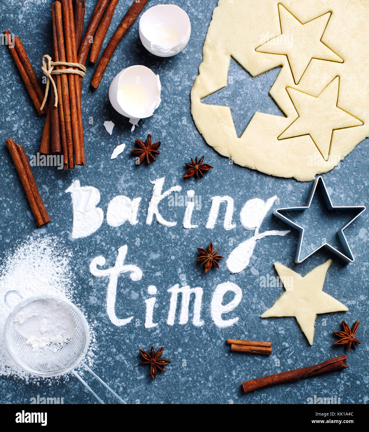 Baking time. Flour sprinkled on the blue table with text baking time ...