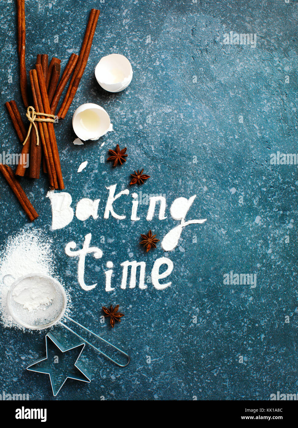 Baking time. Flour sprinkled on the blue table with text baking time ...