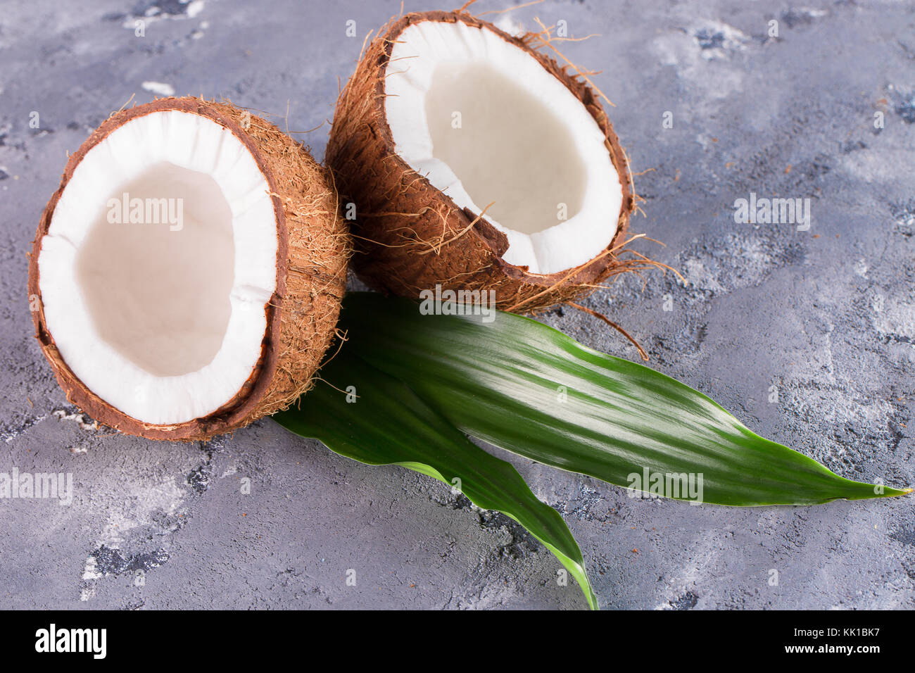 Halves coconuts on brown hi-res stock photography and images - Alamy