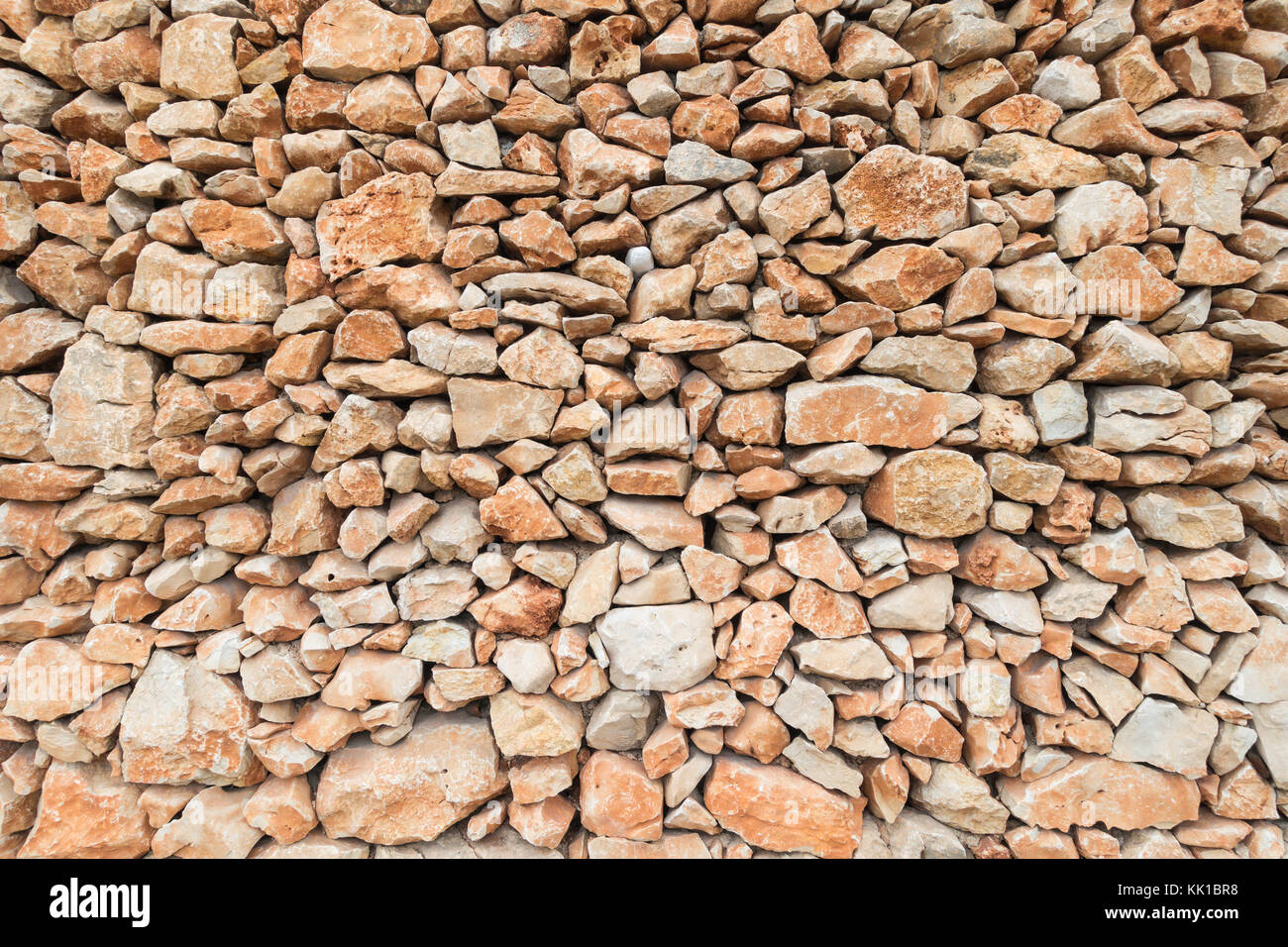 Group of large rocks with a brown orange tint in an open faced wall ...