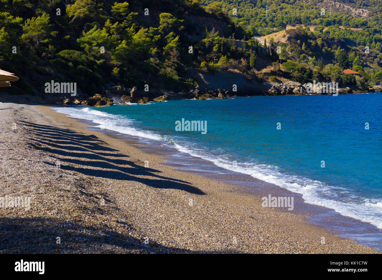 blue sea empty beach and forest on an autumn sunny day greece scenery ...