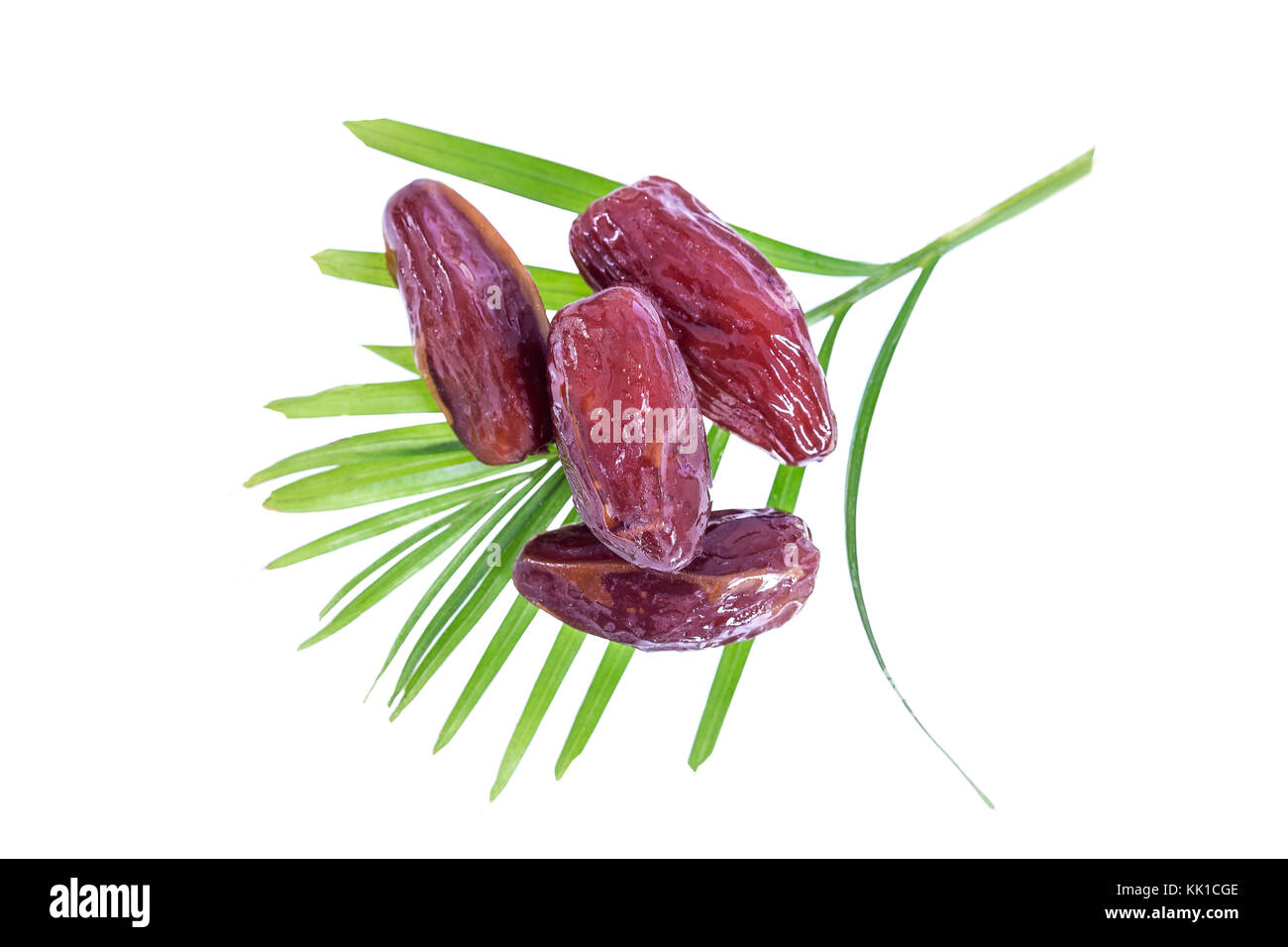 Date palm fruit exotic dried fruit on leaf against white background ...