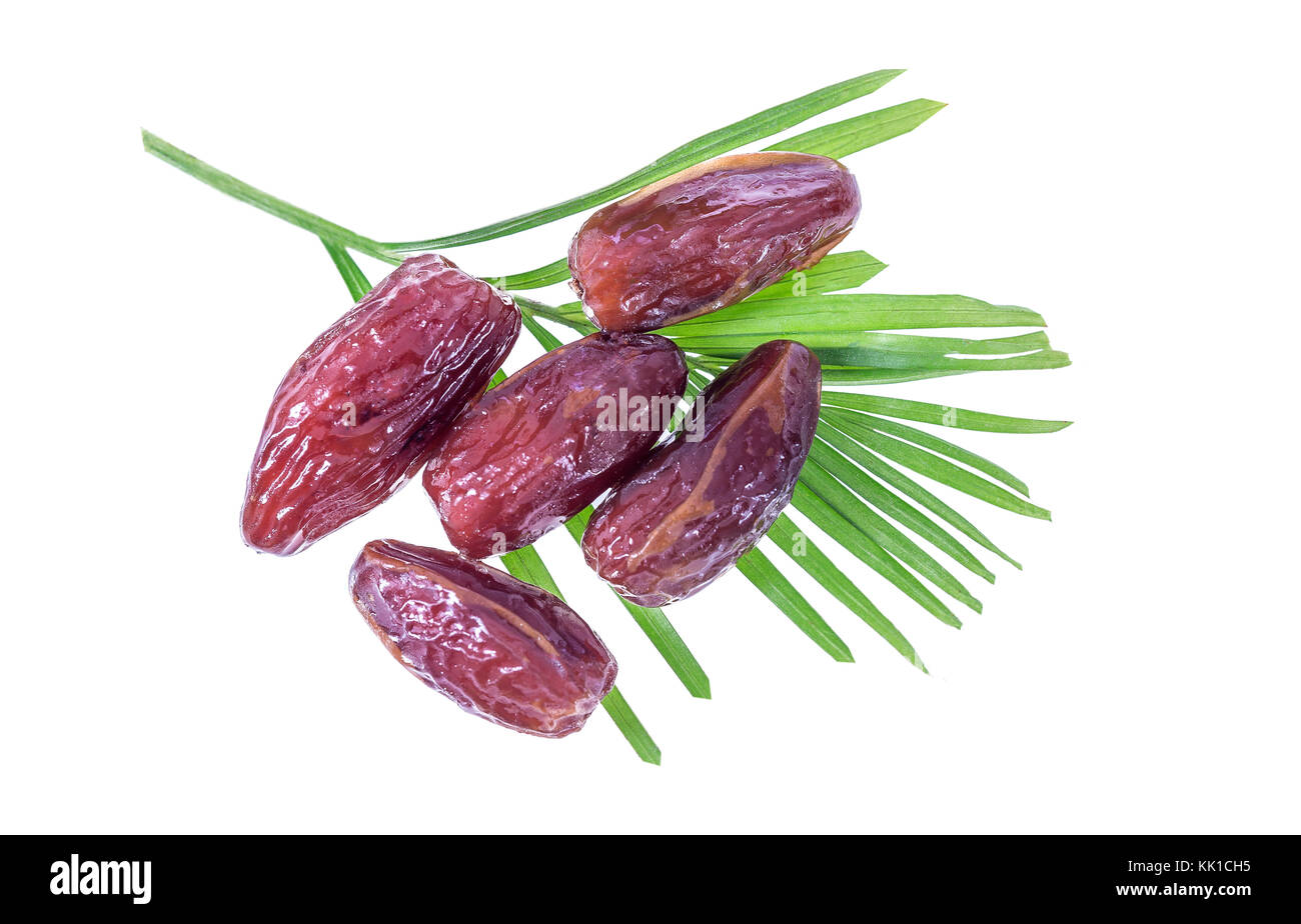Date palm fruit exotic dried fruit on leaf against white background ...