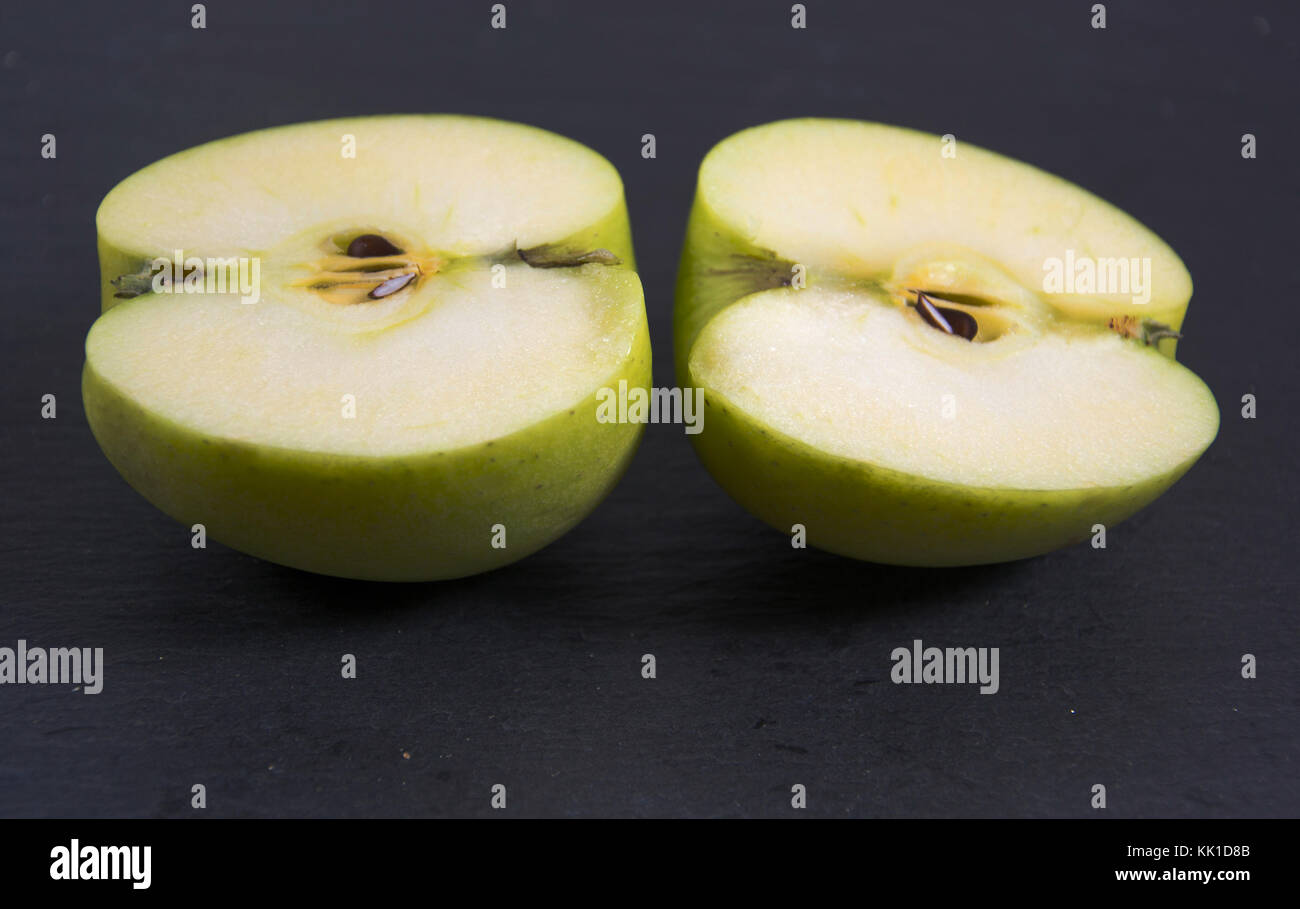 photo of a halved apple Stock Photo - Alamy