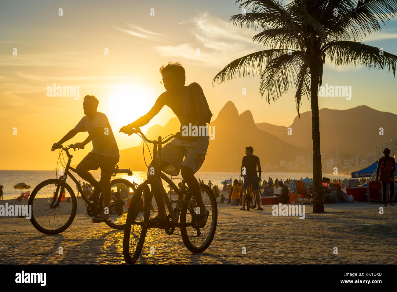 RIO DE JANEIRO - FEBRUARY 22, 2017: Two young men ride bicycles from ...