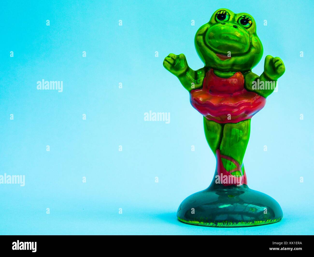 Bright green frog in a tutu doing ballet Stock Photo - Alamy