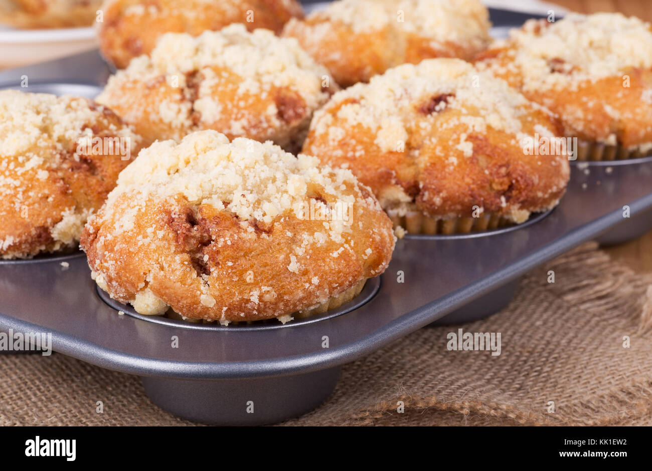 Closeup of a golden brown muffins in a muffin pan Stock Photo - Alamy