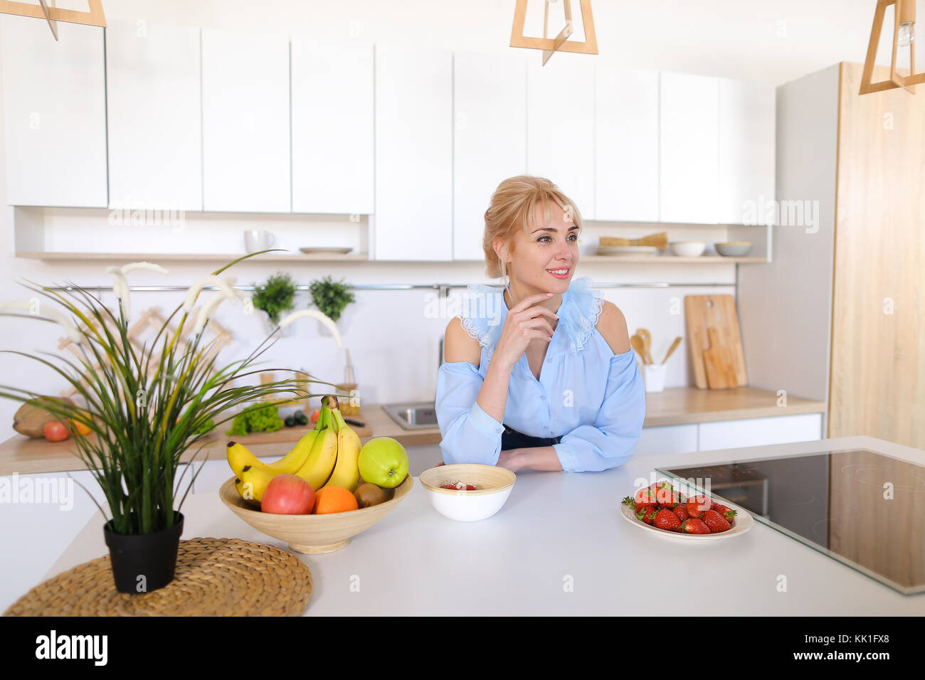 Stylish girl cooks posing for breakfast in morning, standing at Stock ...