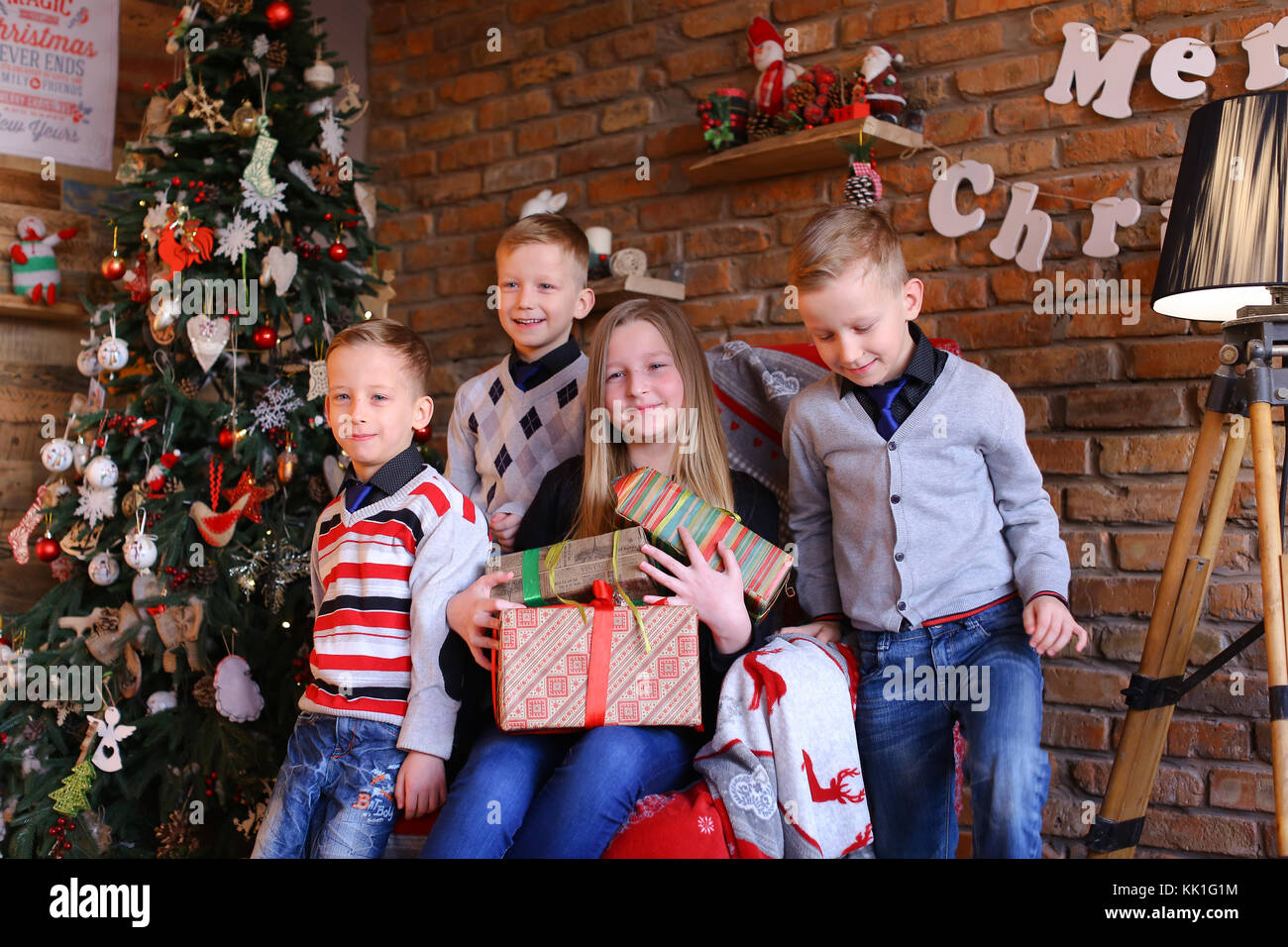 Older sister girl and three boys brothers send greetings congra Stock ...