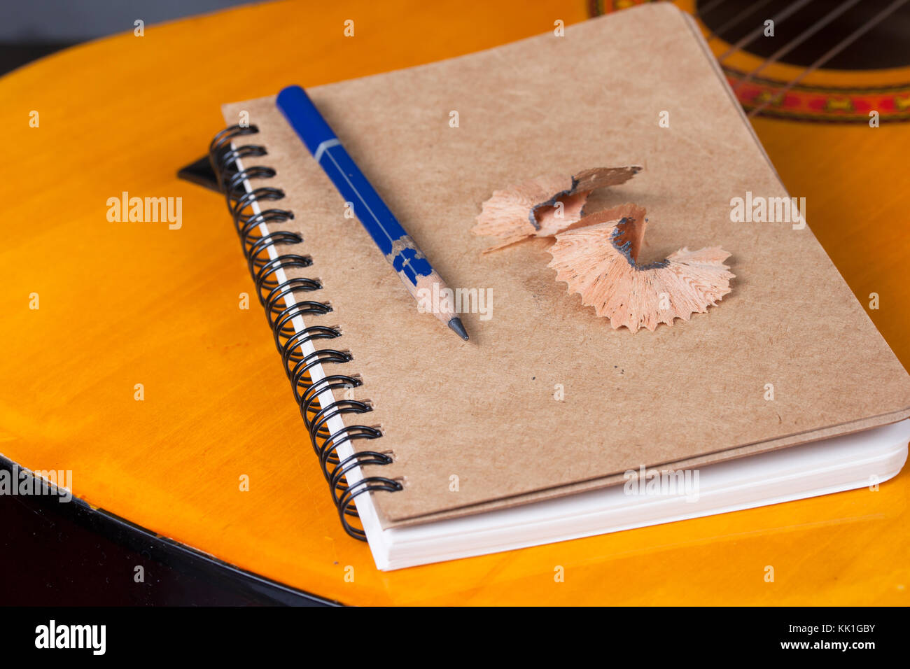 Diary and a used pencil with classical guitar background Stock Photo ...