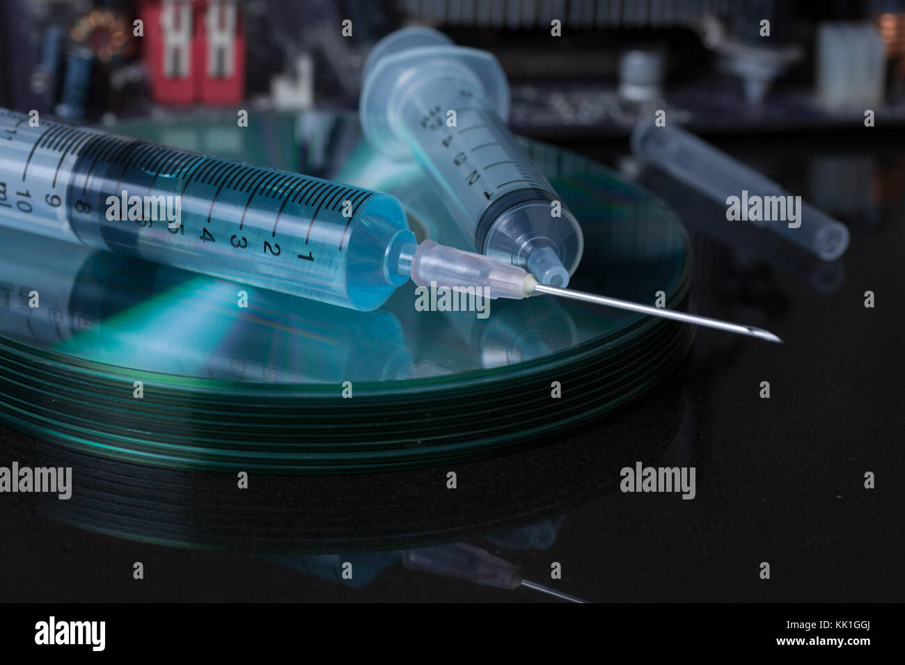 Medical concept, syringe with CDs Stock Photo - Alamy