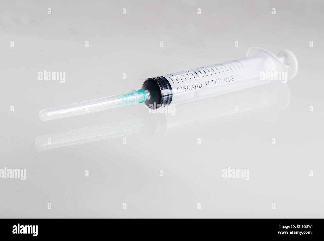 Close up macro view of a syringe / syringes full of coloured fluid ...