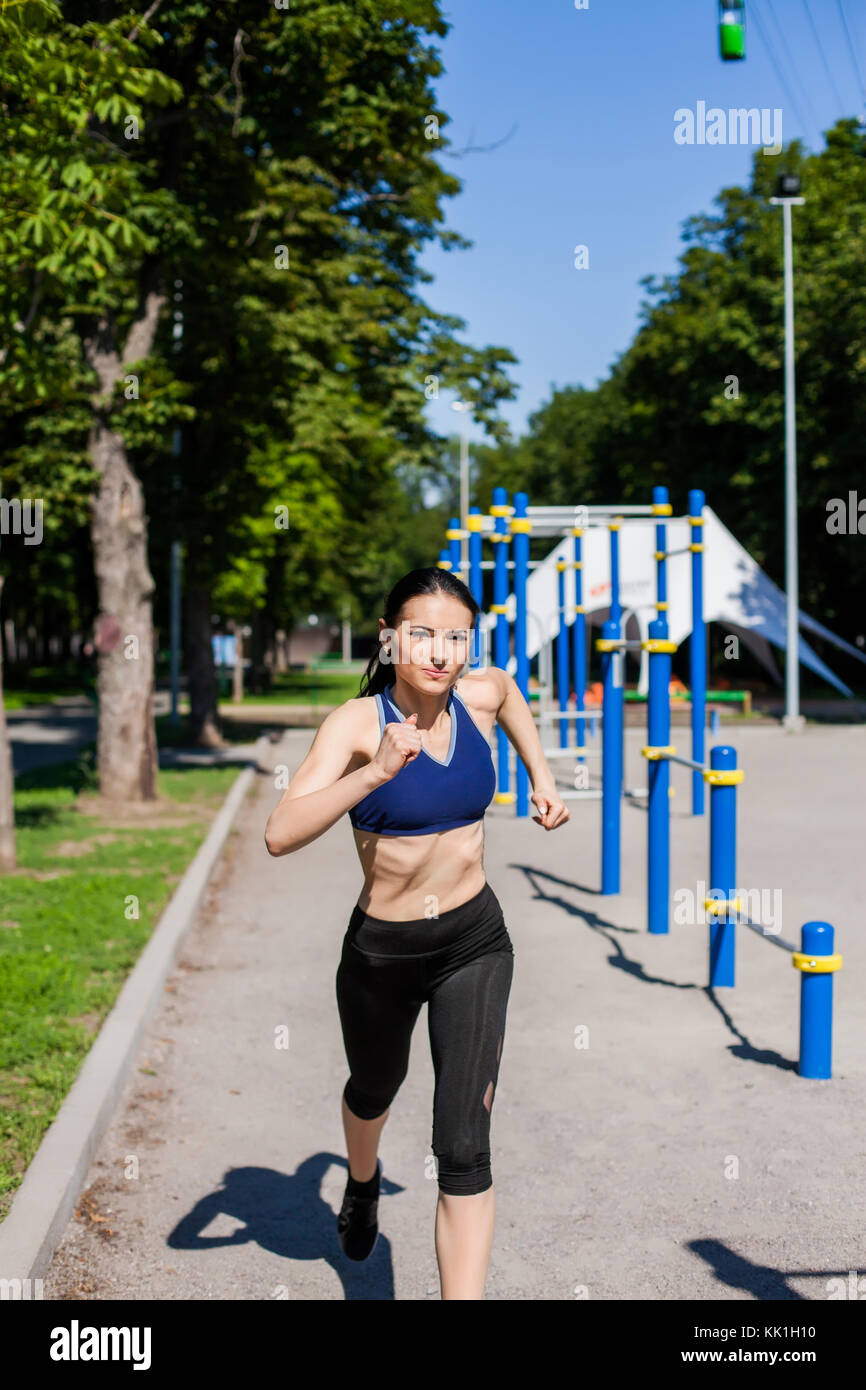 beautiful girl running on the sport playground Stock Photo - Alamy