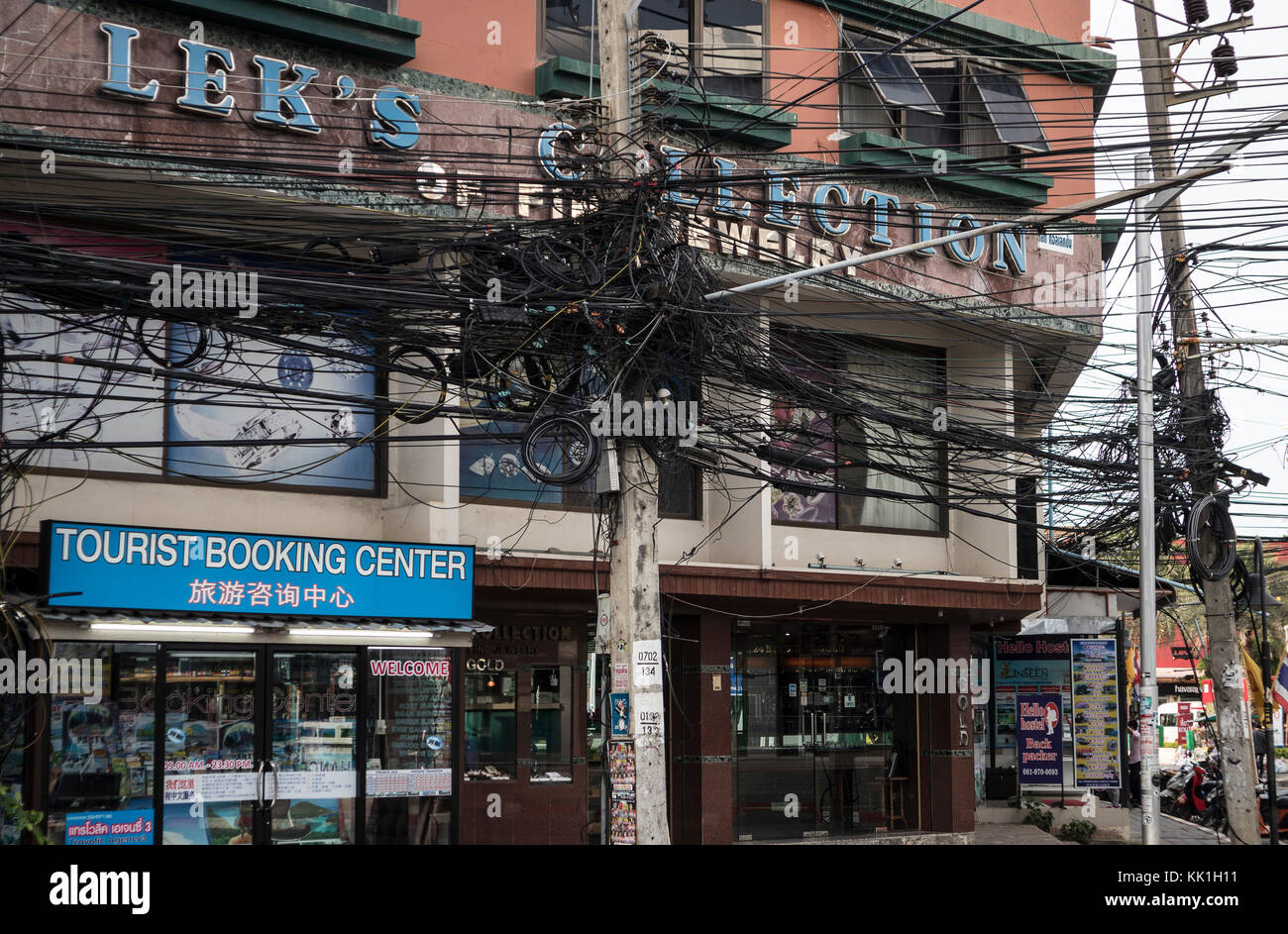 Retail shops on Chaweng, Koh Samui, Thailand. Showing the power cables ...