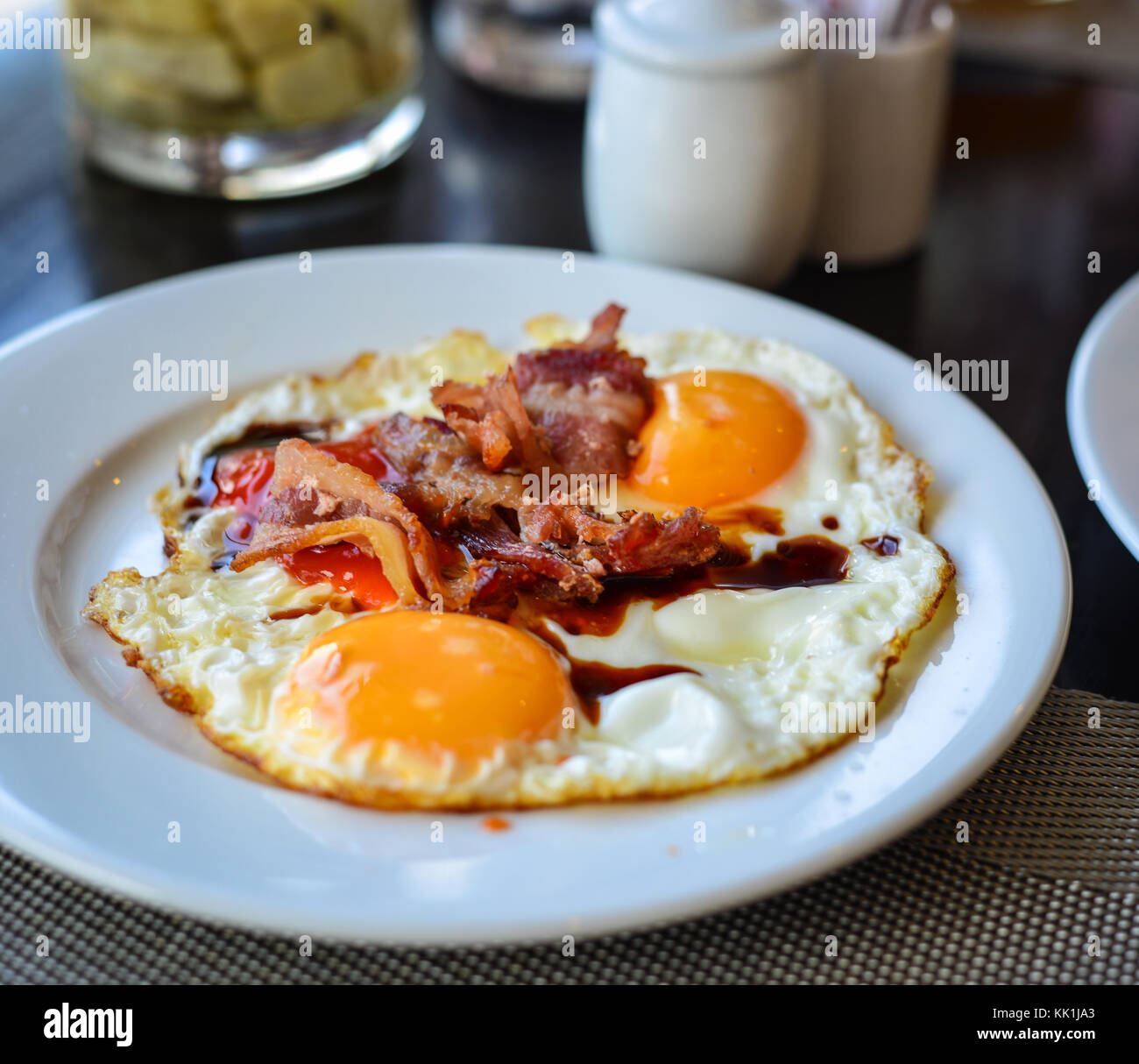 Western breakfast with eggs and bacons at luxury restaurant Stock Photo ...