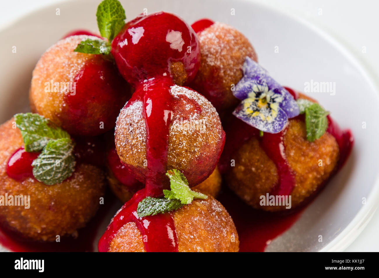 fresh gourmet donut balls desert in white bowl Stock Photo - Alamy