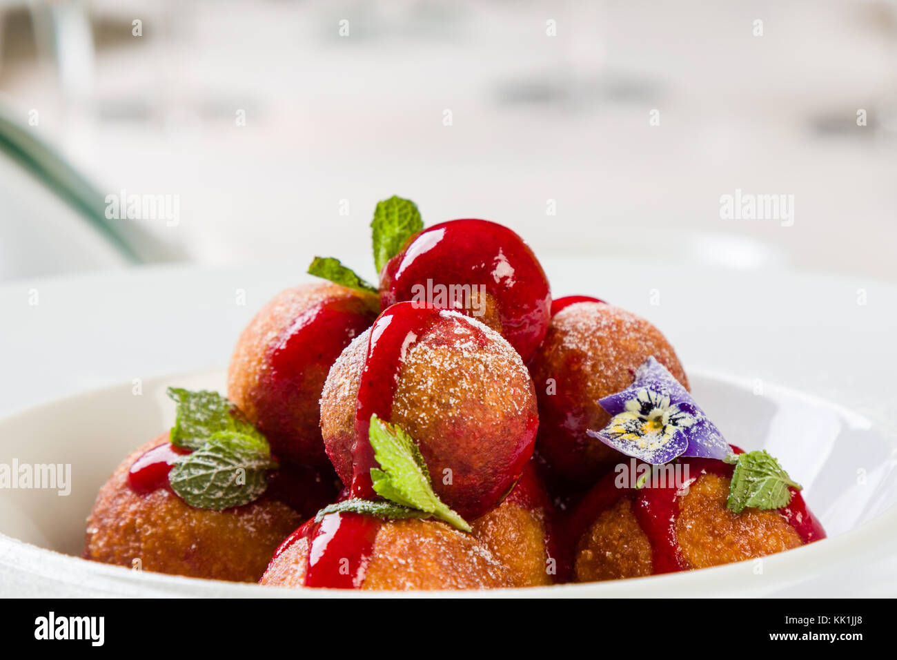 fresh gourmet donut balls desert in white bowl Stock Photo - Alamy