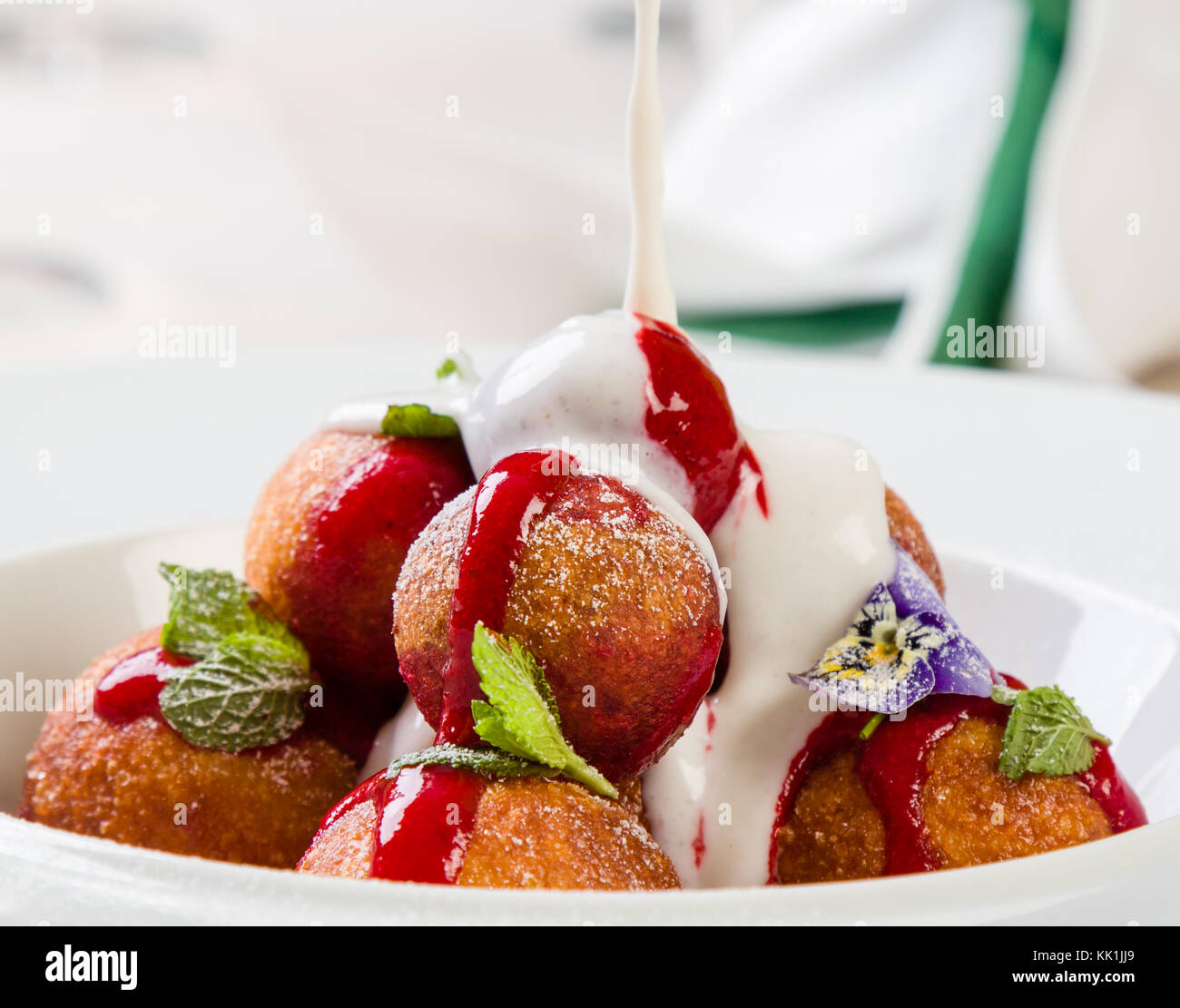 fresh gourmet donut balls desert in white bowl Stock Photo - Alamy