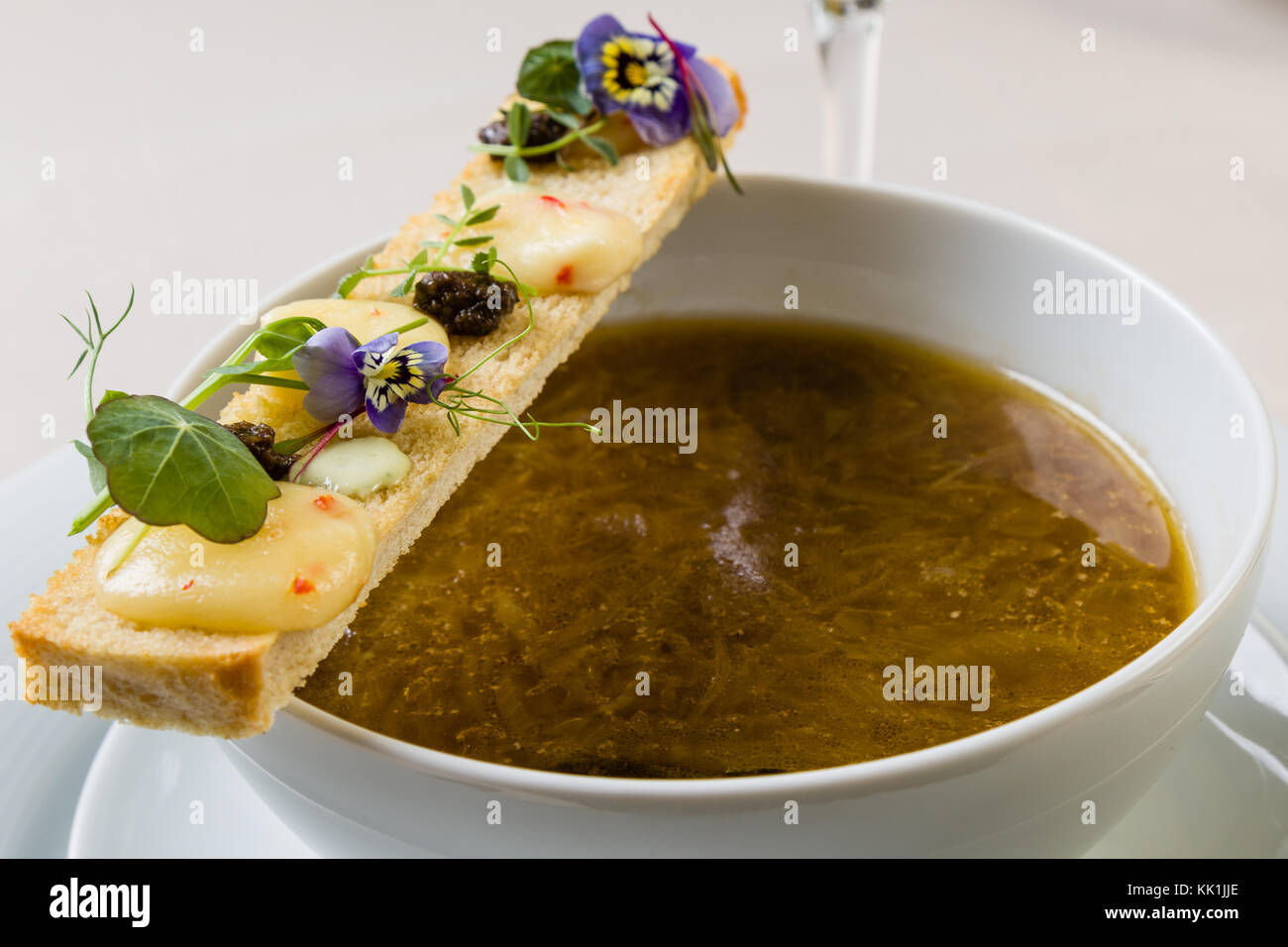 stylish gourmet onion soup with decorated toast slice Stock Photo - Alamy