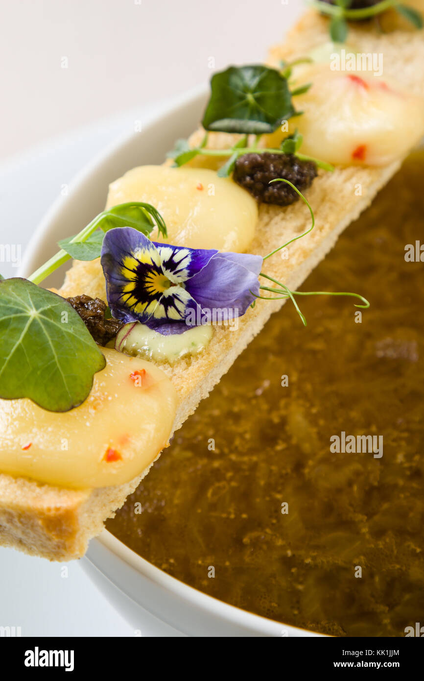stylish gourmet onion soup with decorated toast slice Stock Photo - Alamy