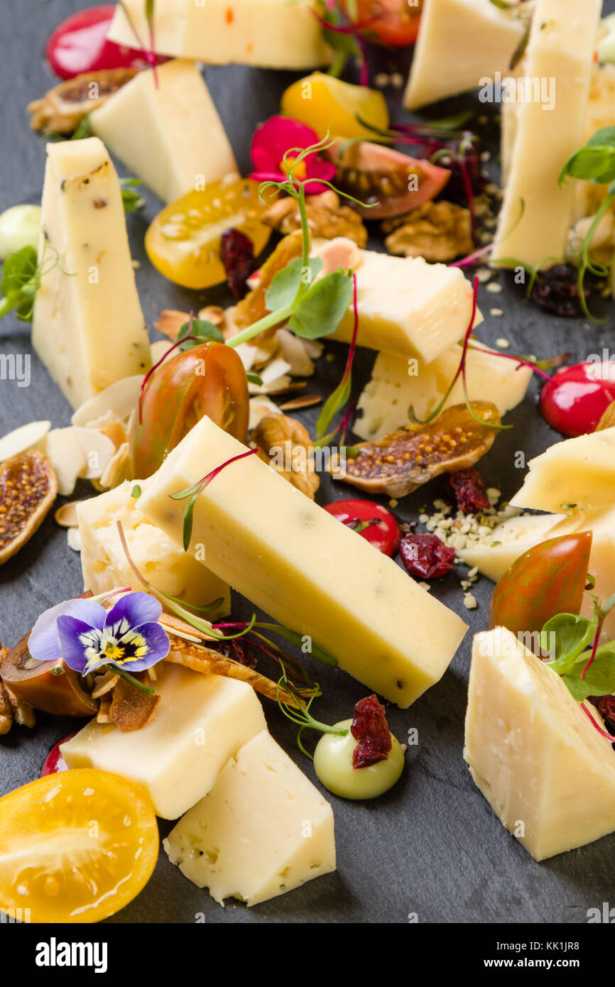 gourmet cheese platter with different types of cheese Stock Photo - Alamy