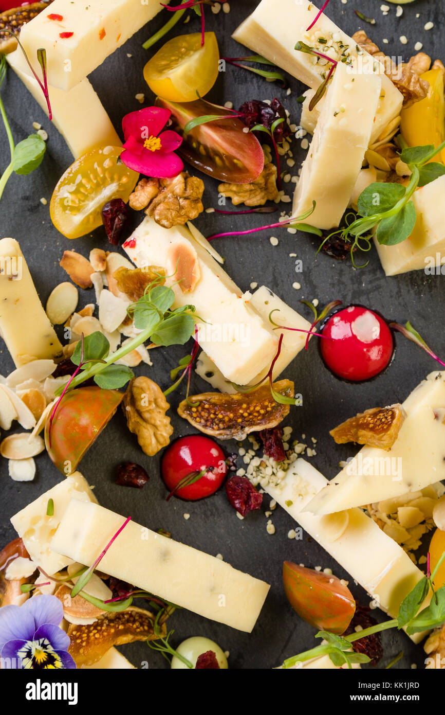 gourmet cheese platter with different types of cheese Stock Photo - Alamy