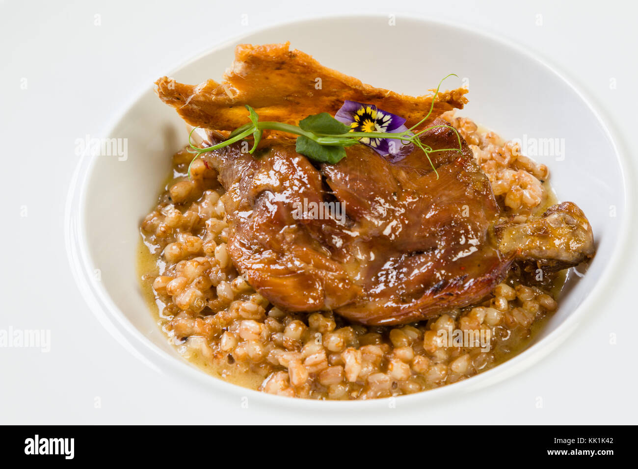 gourmet fresh duck with barley in white palte Stock Photo - Alamy
