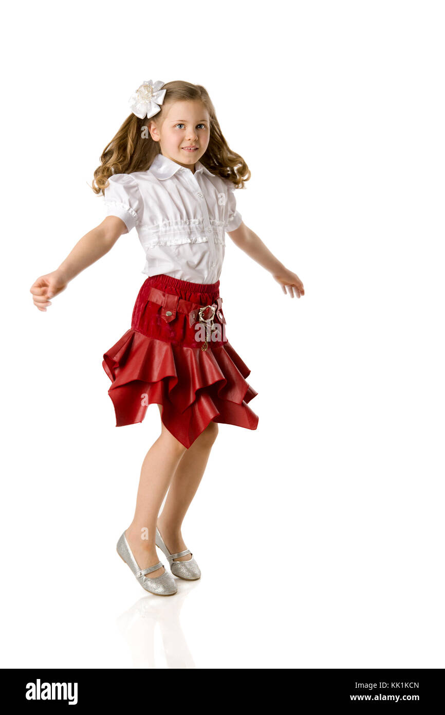 Cheerful girl spinning on floor isolated on white Stock Photo - Alamy