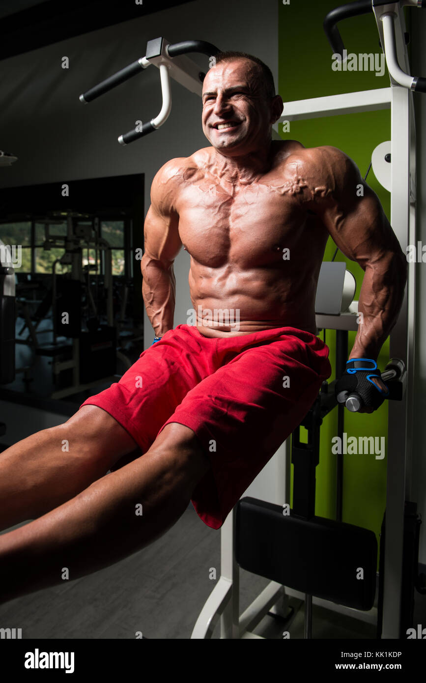 Muscular Fitness Bodybuilder Doing Heavy Weight Exercise For Triceps ...