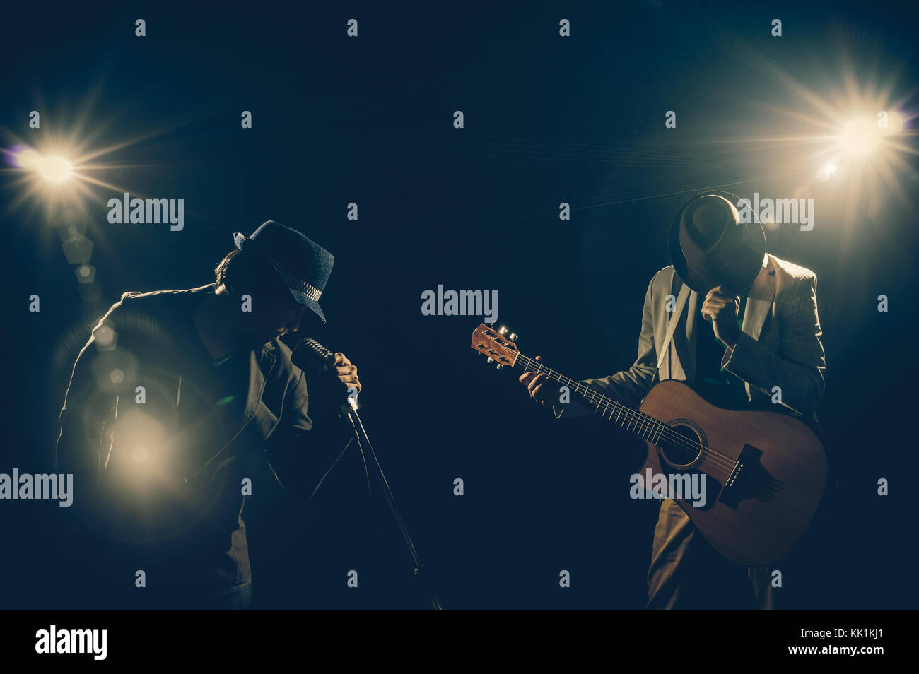 Musician Duo band hand holding the microphone and singing a song and ...