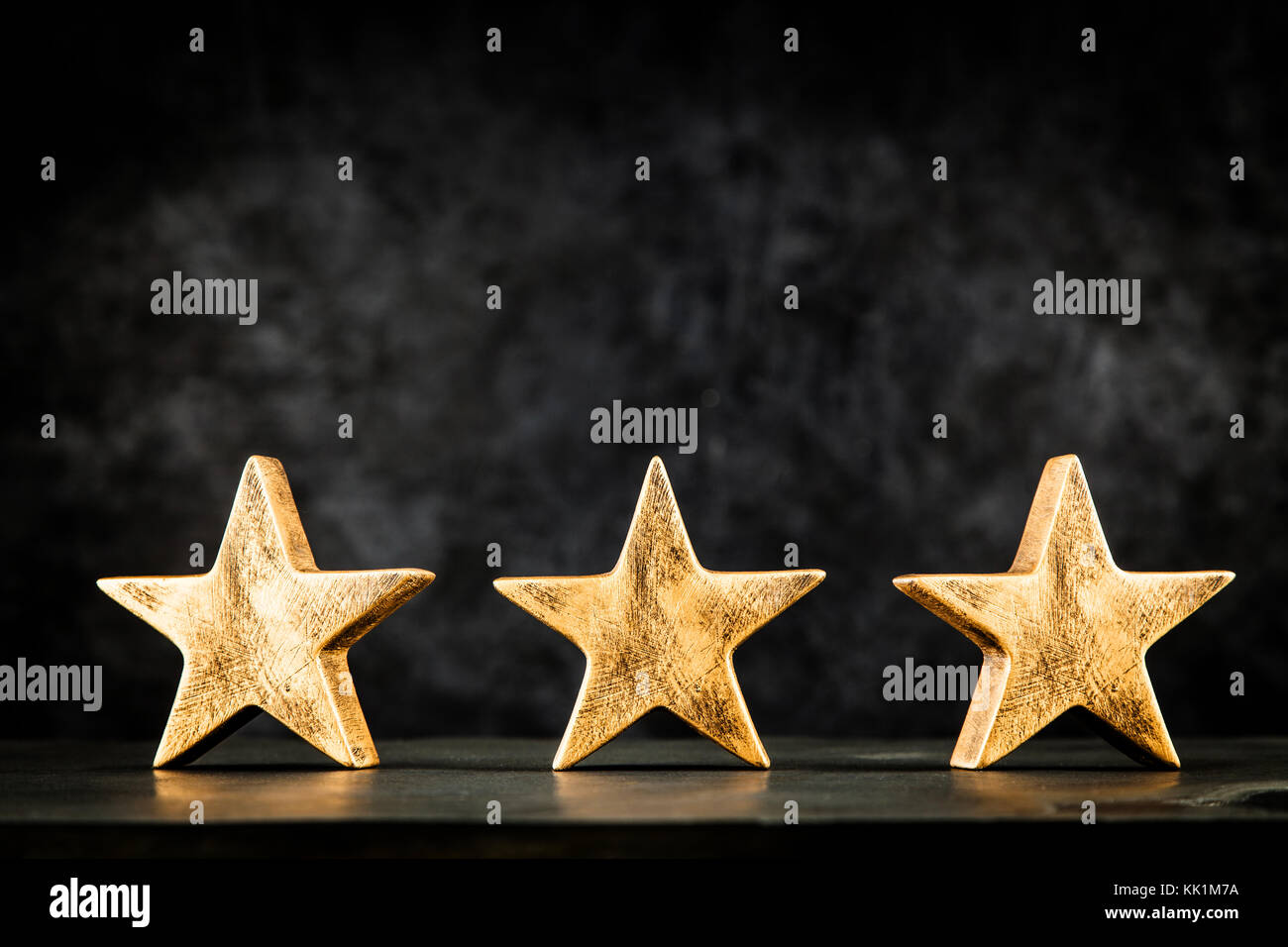 Three stars on dark background Stock Photo - Alamy