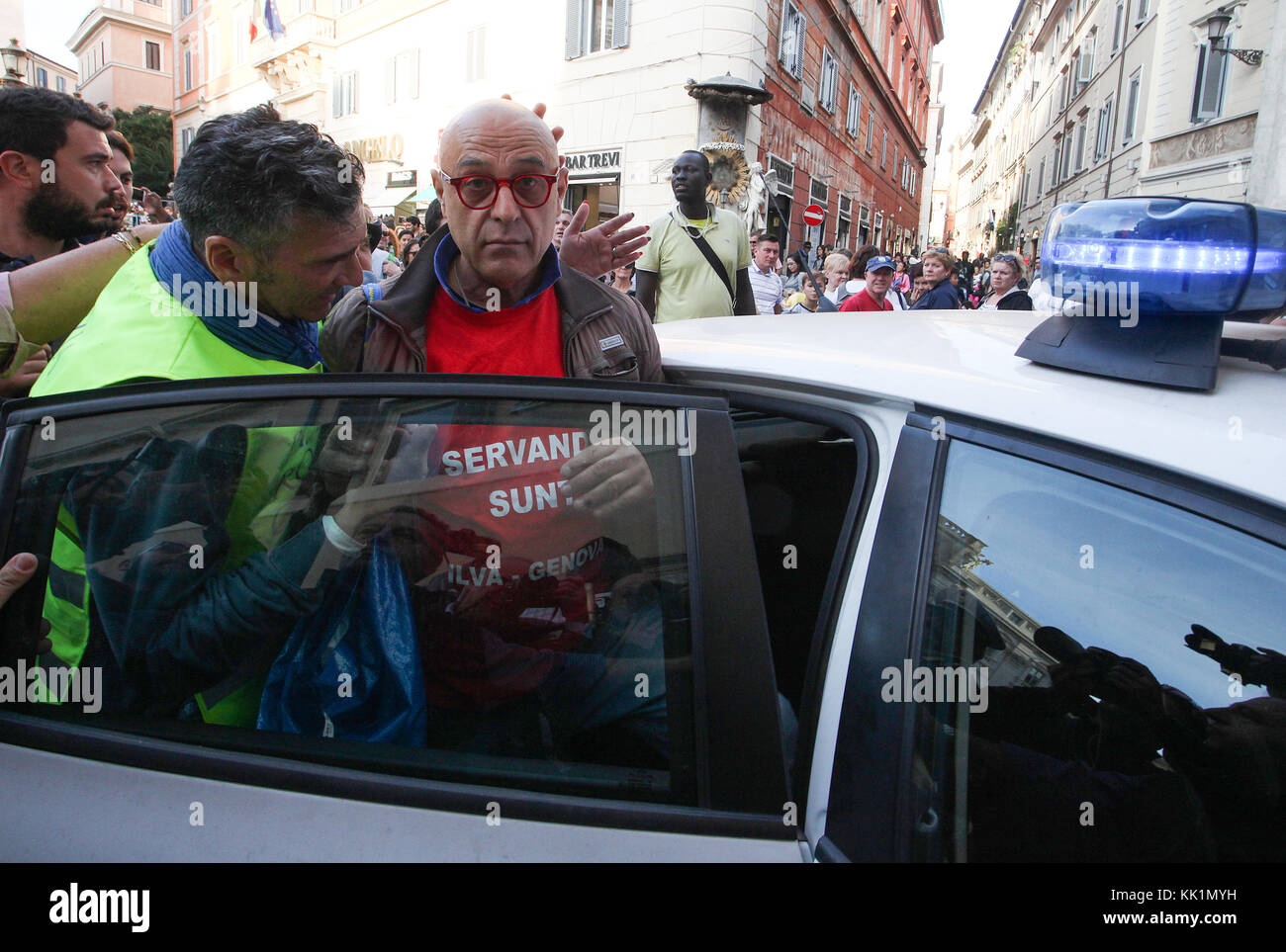 Artist Tiziano Cecchini pours a red liquid into the Trevi fountain in ...