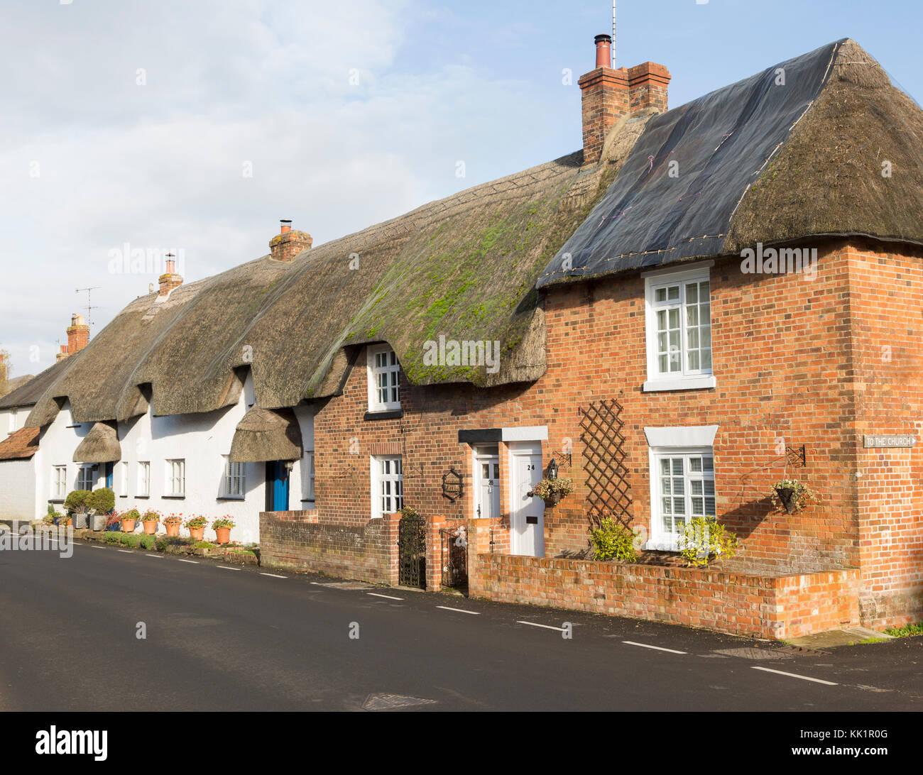 Historic row of thatched cottages in village of Upavon, Wiltshire ...