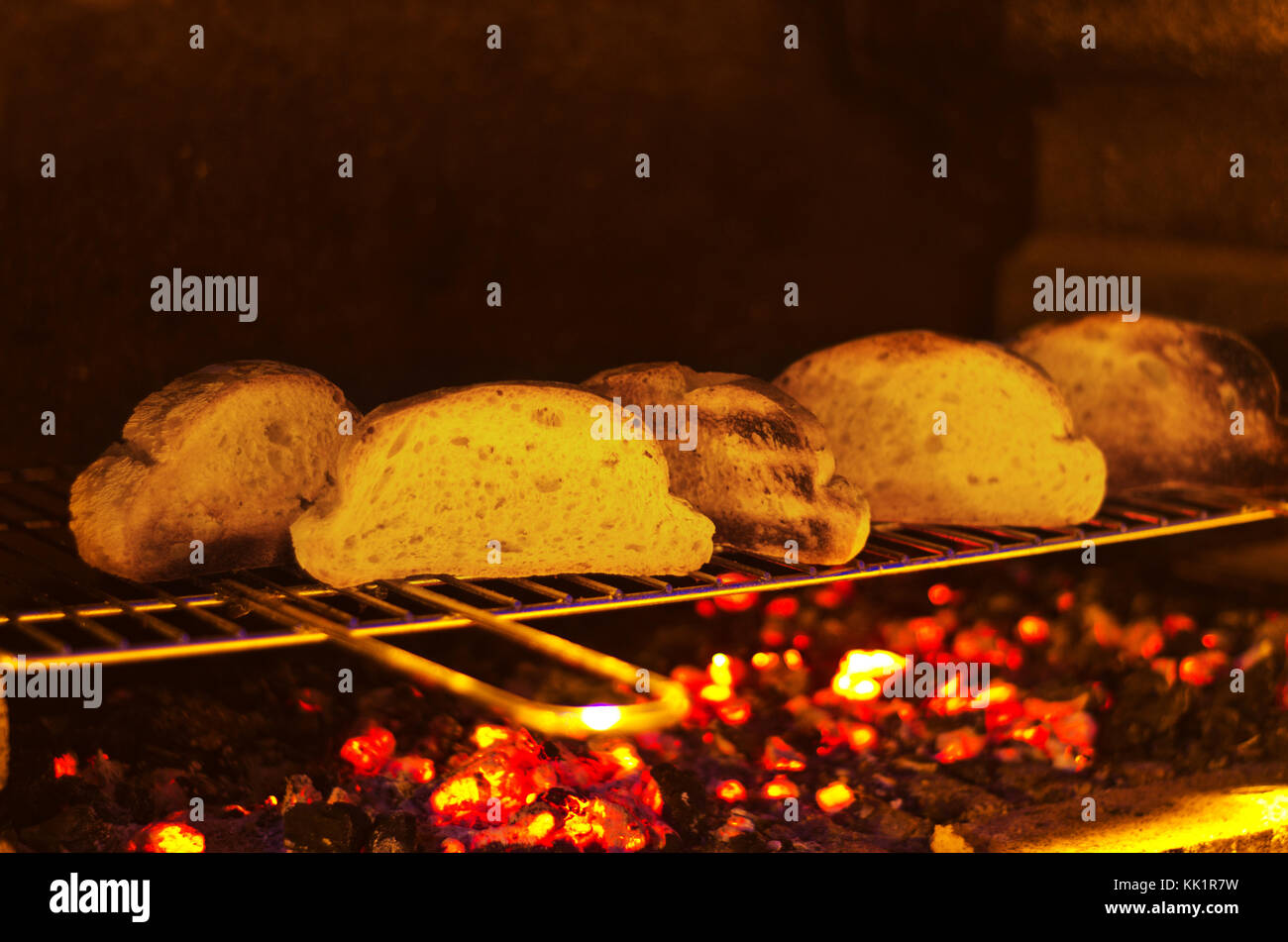 slices of crispy and abrasive bread on incandescent coal Stock Photo ...