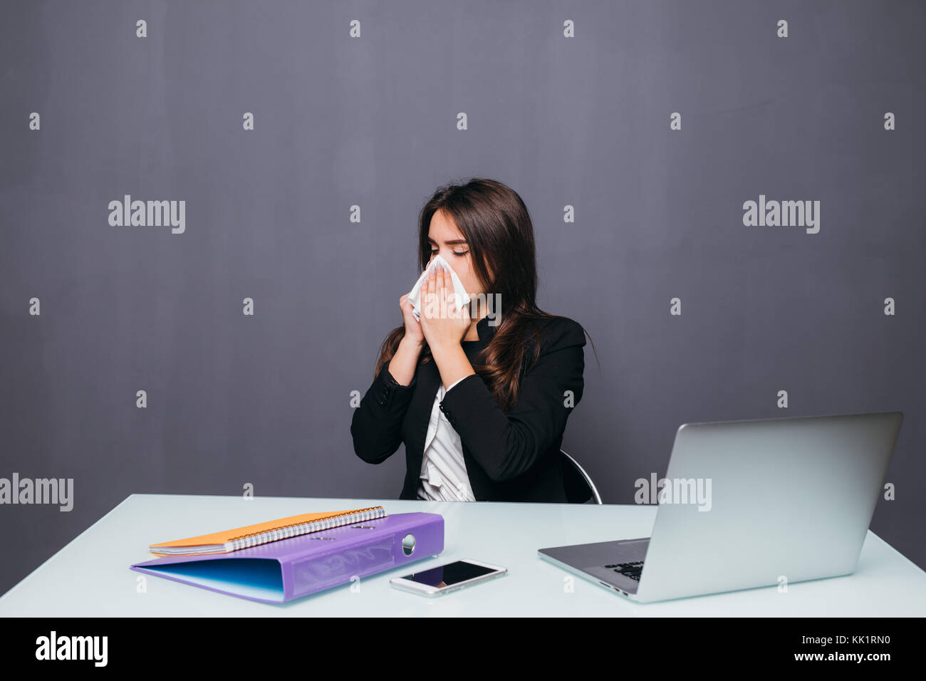 Young pretty businesswoman sick in the office Stock Photo - Alamy