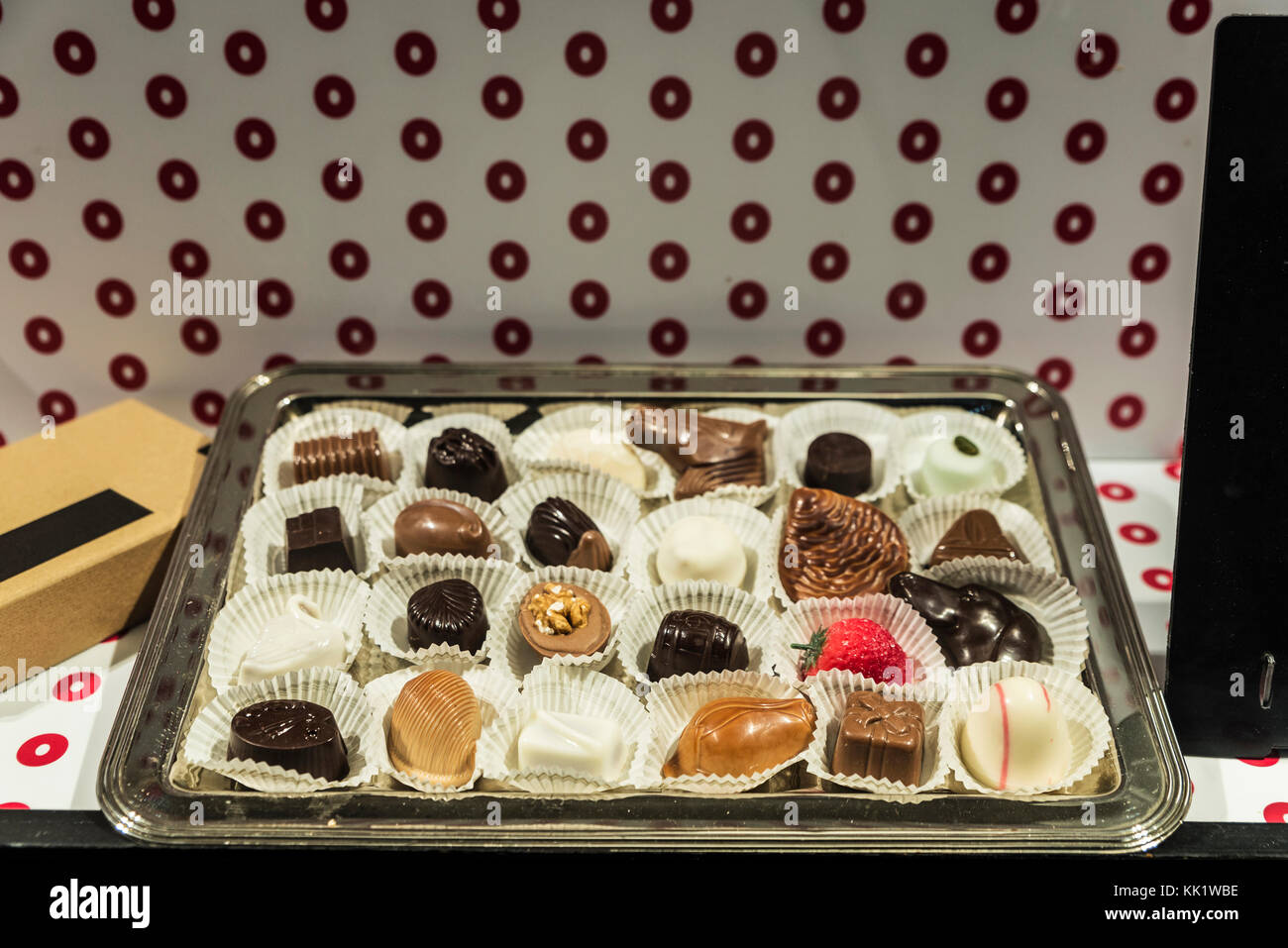 Assortment of traditional belgian chocolate in the shop window of a ...