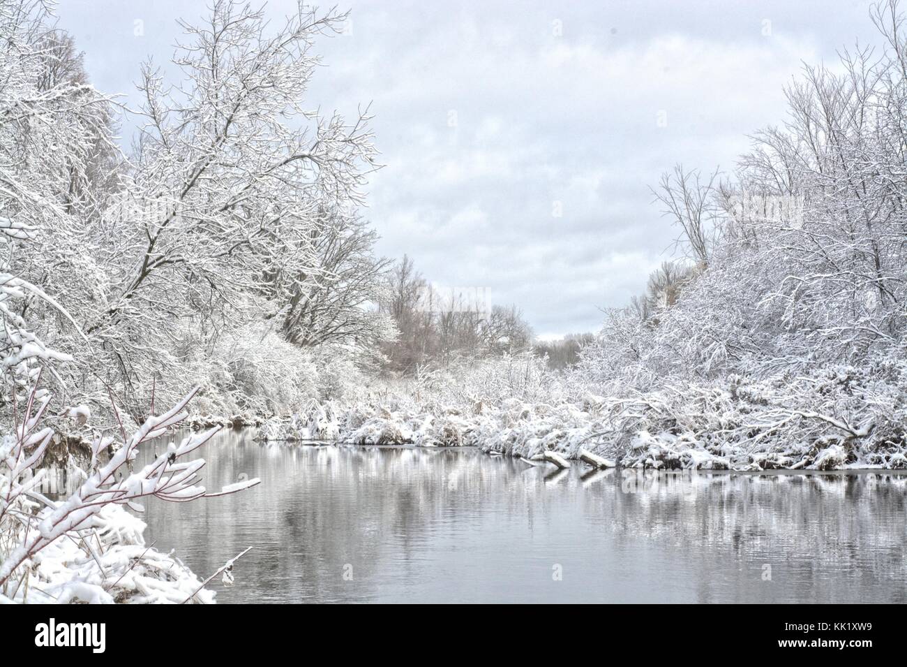 Snowy winter landscape by the river with trees Stock Photo - Alamy