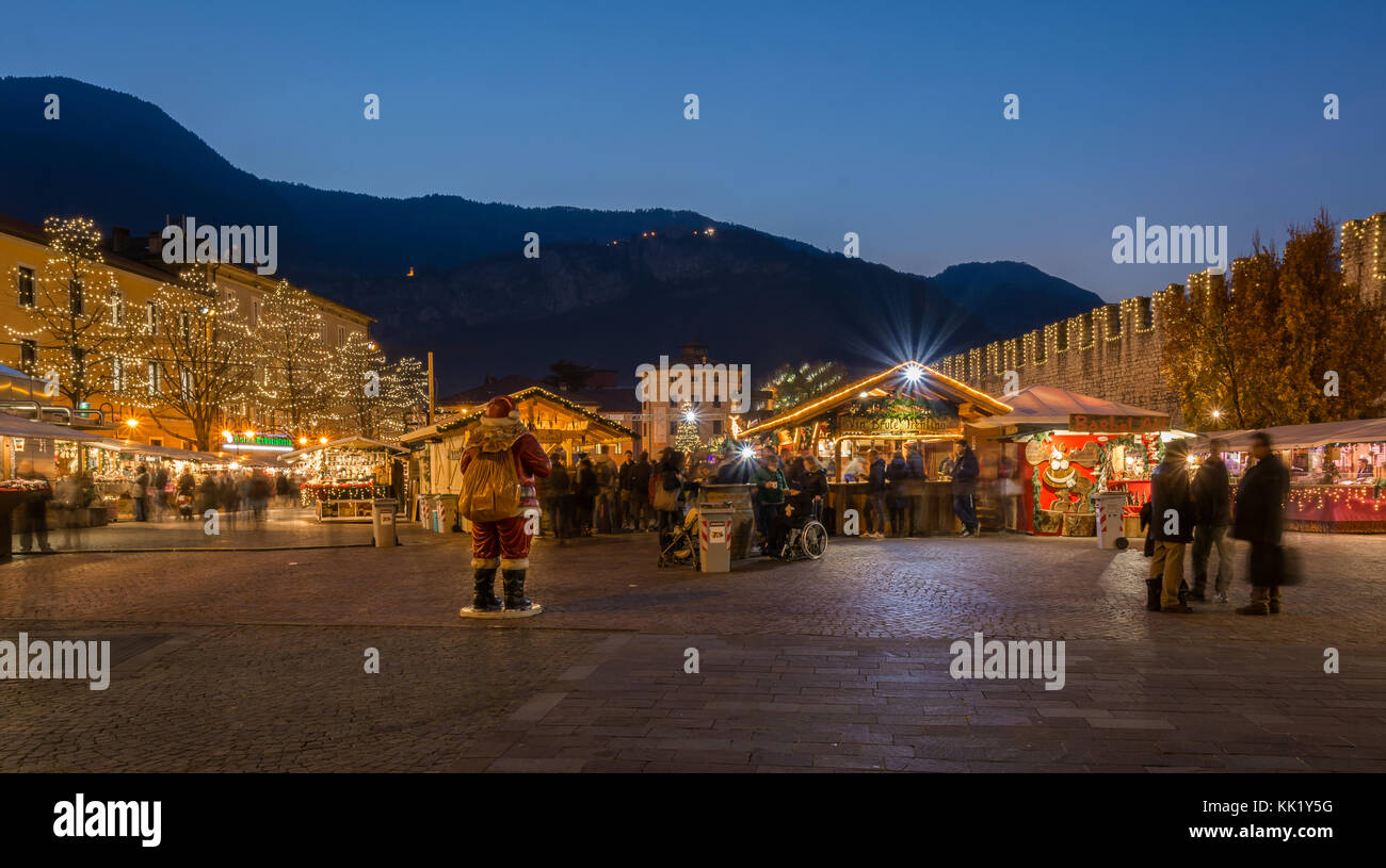 The colorful christmas market in Trento city in the evening. Trentino ...