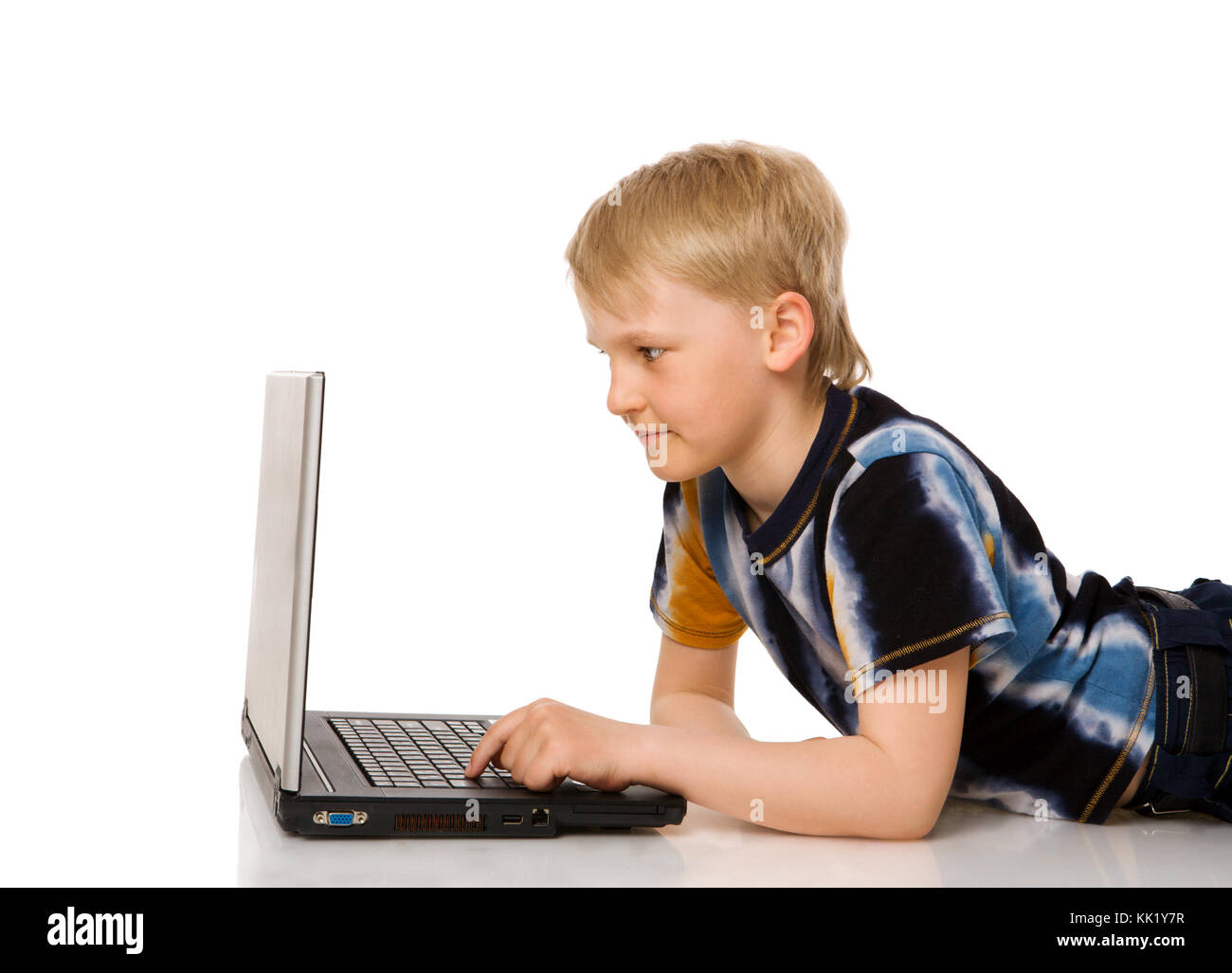 sevenn years Boy Surfing the net isolated on white Stock Photo - Alamy
