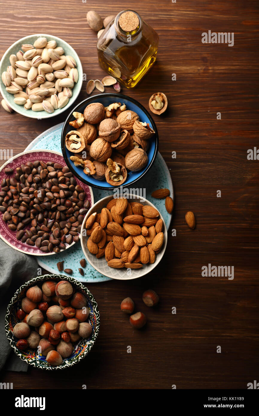 Mixed nuts on wood background Stock Photo - Alamy