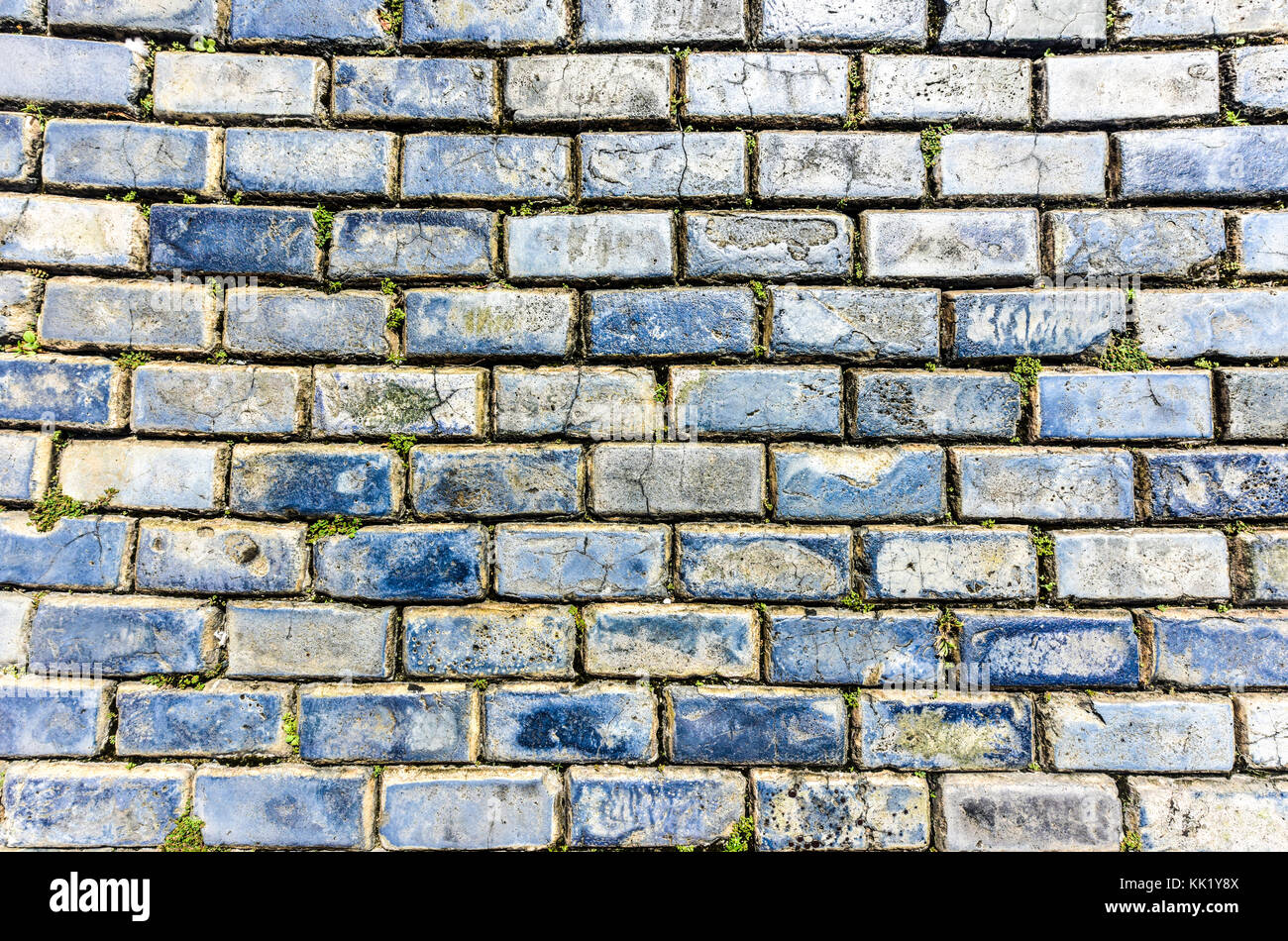 Blue cobblestone paved street in Old San Juan, Puerto Rico. They were ...