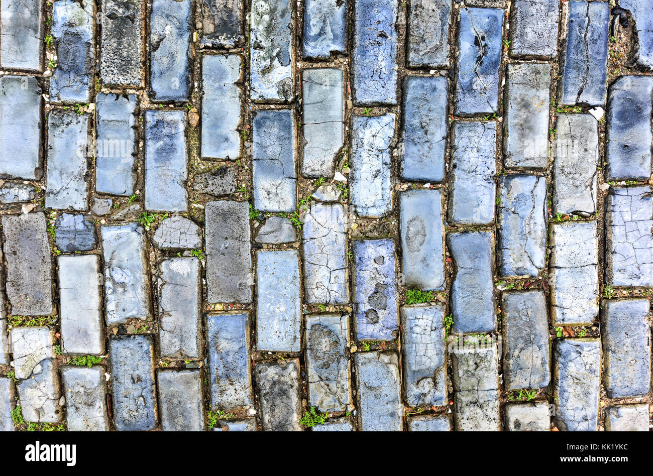 Blue cobblestone paved street in Old San Juan, Puerto Rico. They were ...