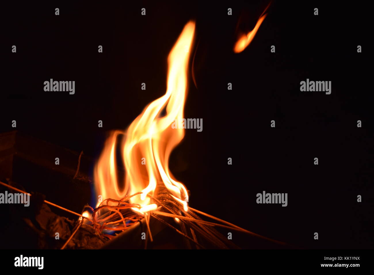 Flame, burning sticks, glass-like flames Stock Photo - Alamy