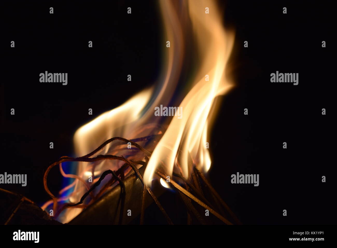 Flame, burning sticks, glass-like flames Stock Photo - Alamy