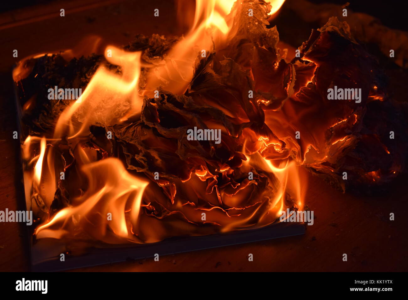 Book burns bright flame hi-res stock photography and images - Alamy