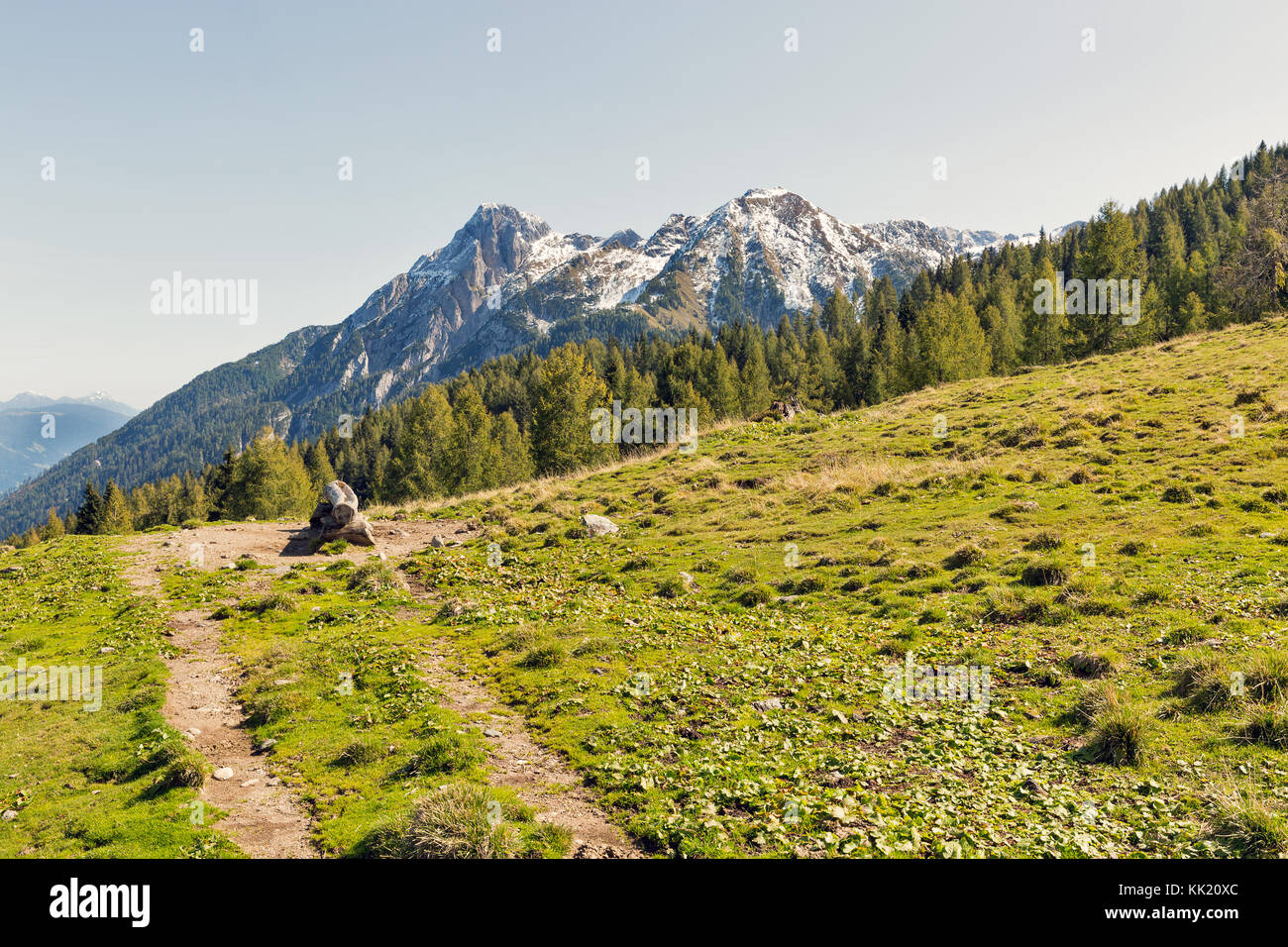 Alpine mountain highland landscape with pasture water trough in Western ...